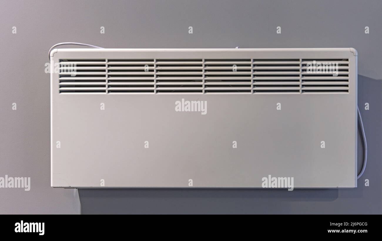 Plain White Electric Space Heater Mounted at Wall Stock Photo - Alamy
