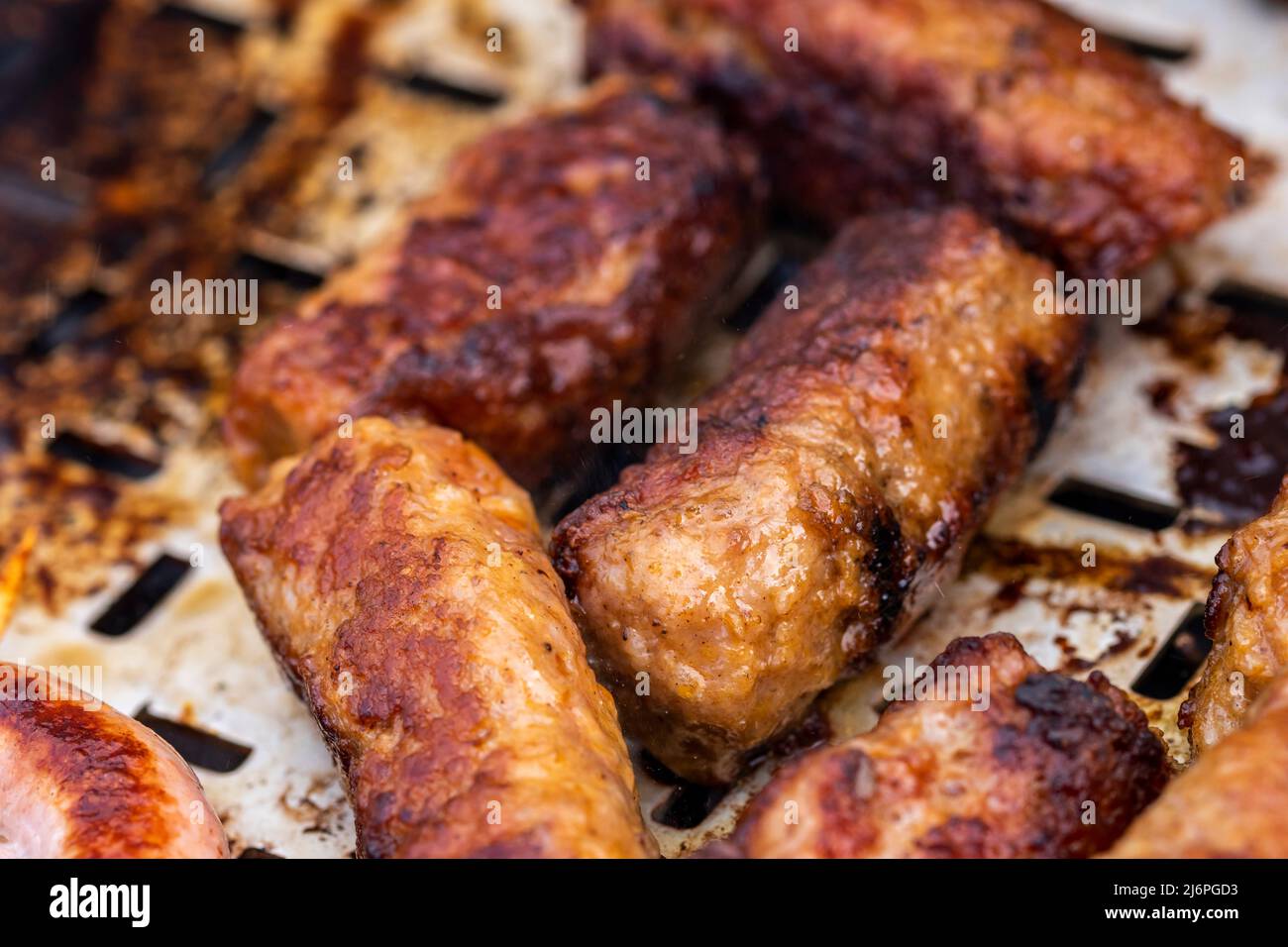 Traditional Romanian food called "mici" which consist of pork meat ...
