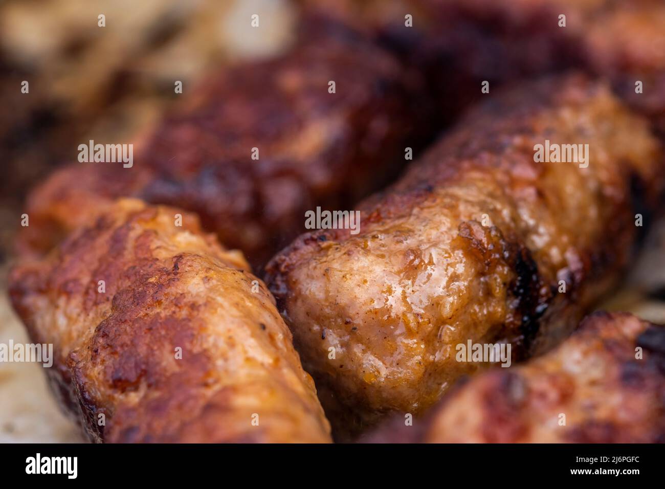 Traditional Romanian food called "mici" which consist of pork meat ...