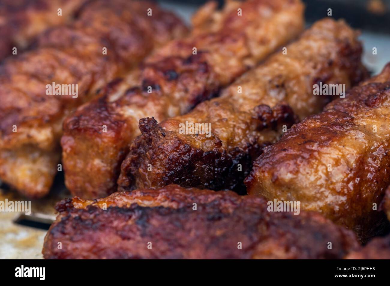 Traditional Romanian food called "mici" which consist of pork meat ...