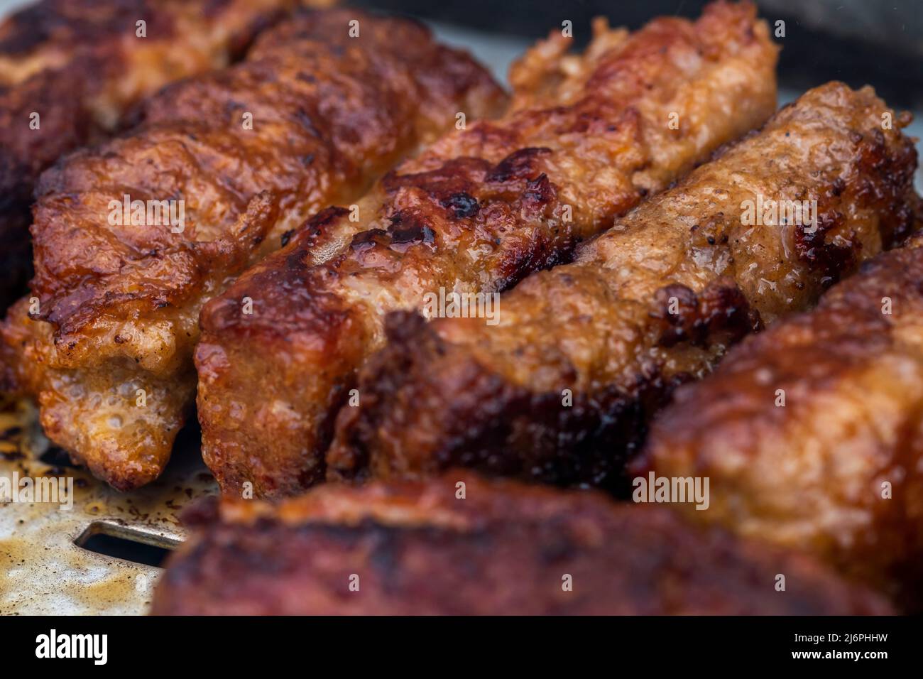 Traditional Romanian food called "mici" which consist of pork meat ...