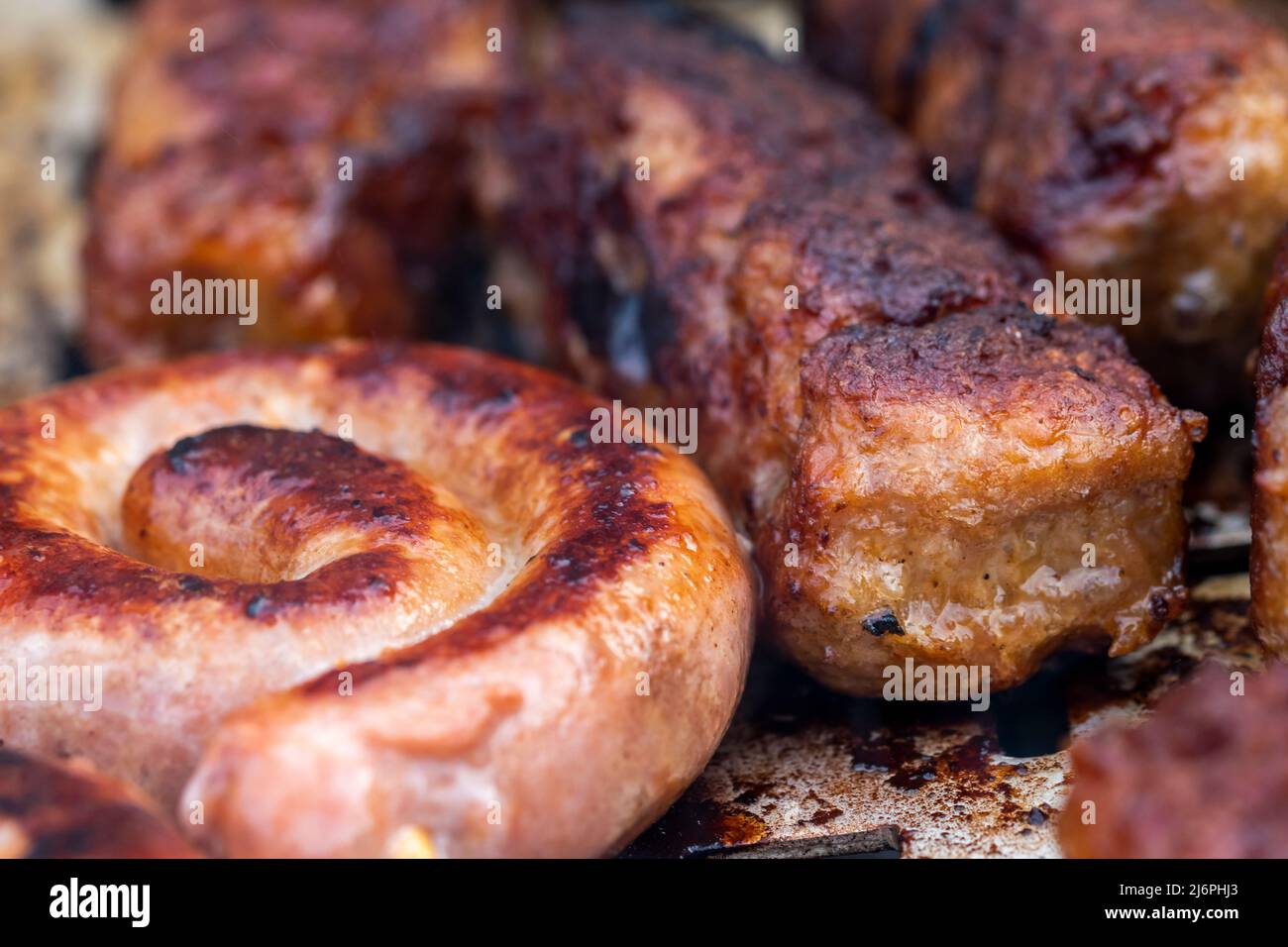Traditional Romanian food called "mici" which consist of pork meat ...