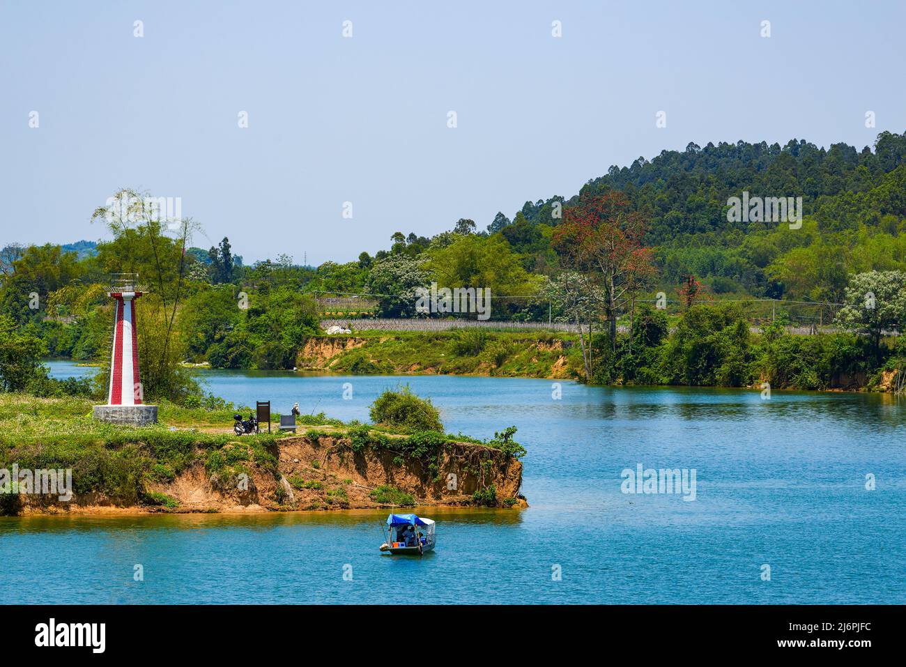 Countryside riverside scenery and sailing lighthouse Stock Photo - Alamy