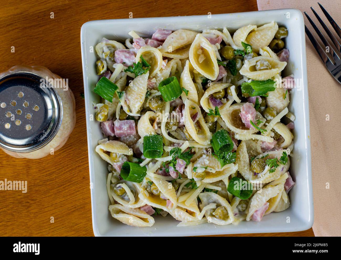 pasta shell salad with ham and peas top with green onions and parsley ...