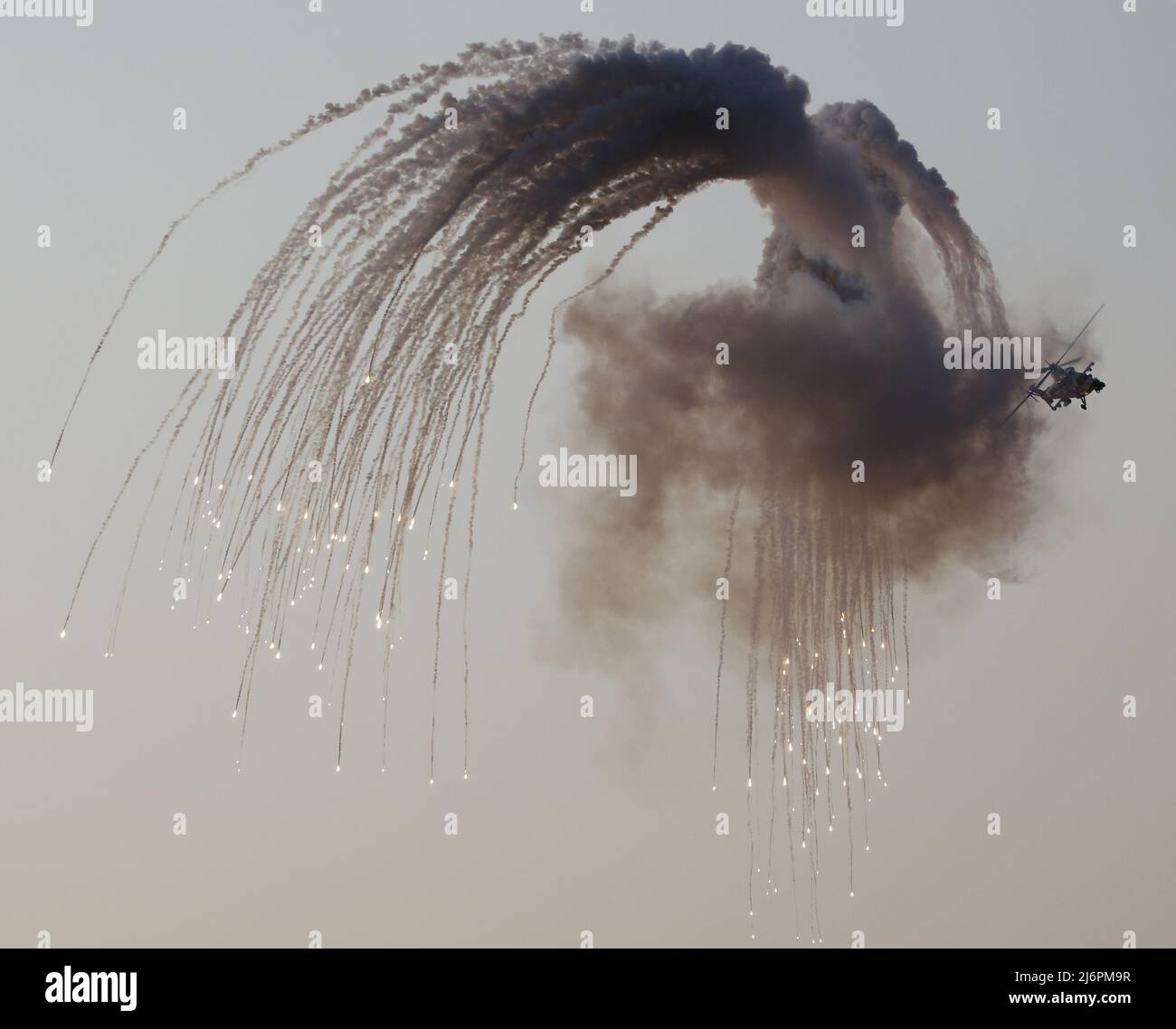 Flare firing SAAF Rooivalk helicopter Stock Photo - Alamy