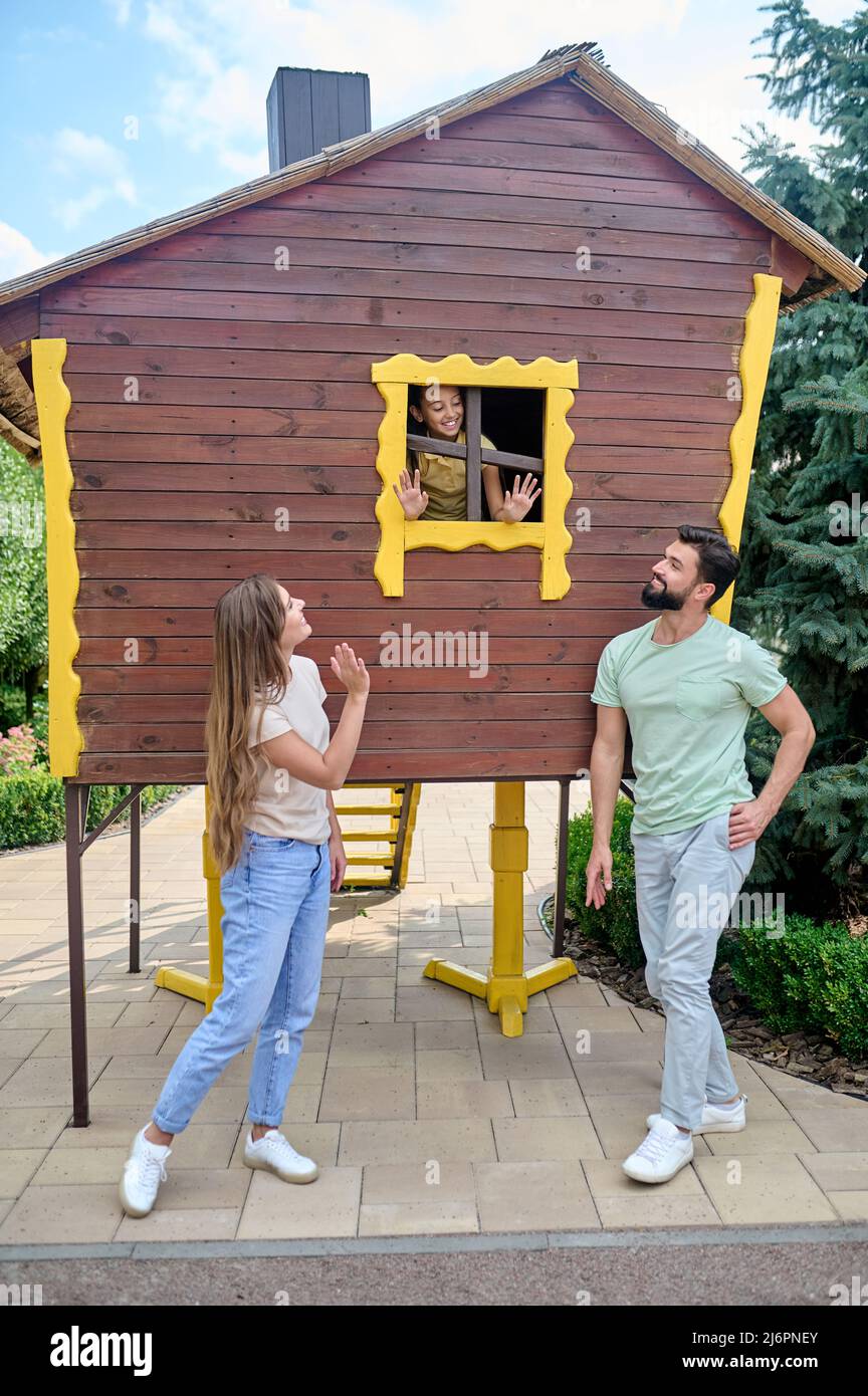 A girl is exploring a small house in a theme park Stock Photo - Alamy