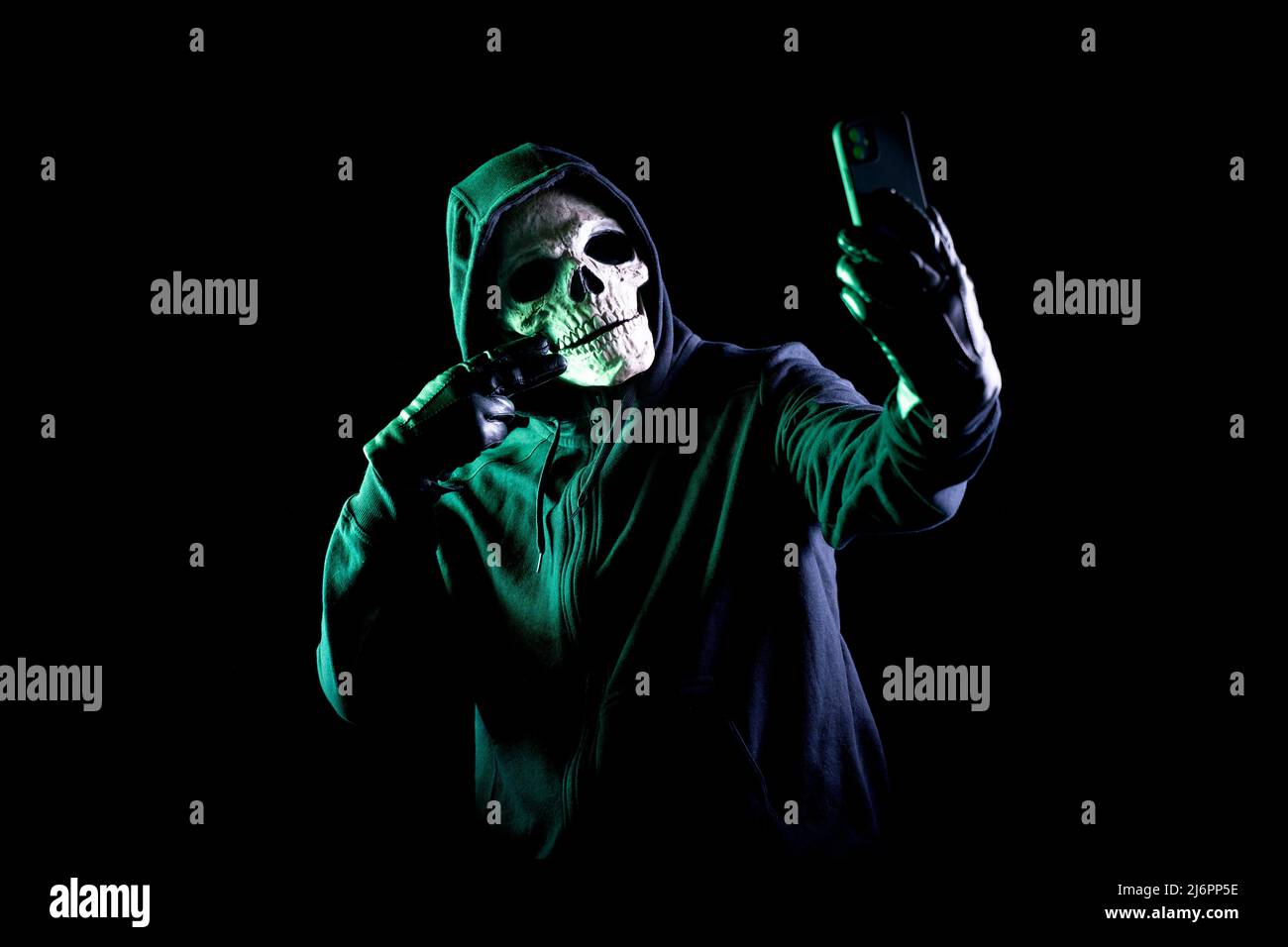 Modern death character on a black background taking a selfie with his ...