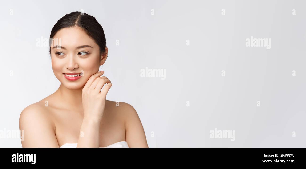 Beautiful asian woman makeup of cosmetic, girl hand touch cheek and ...