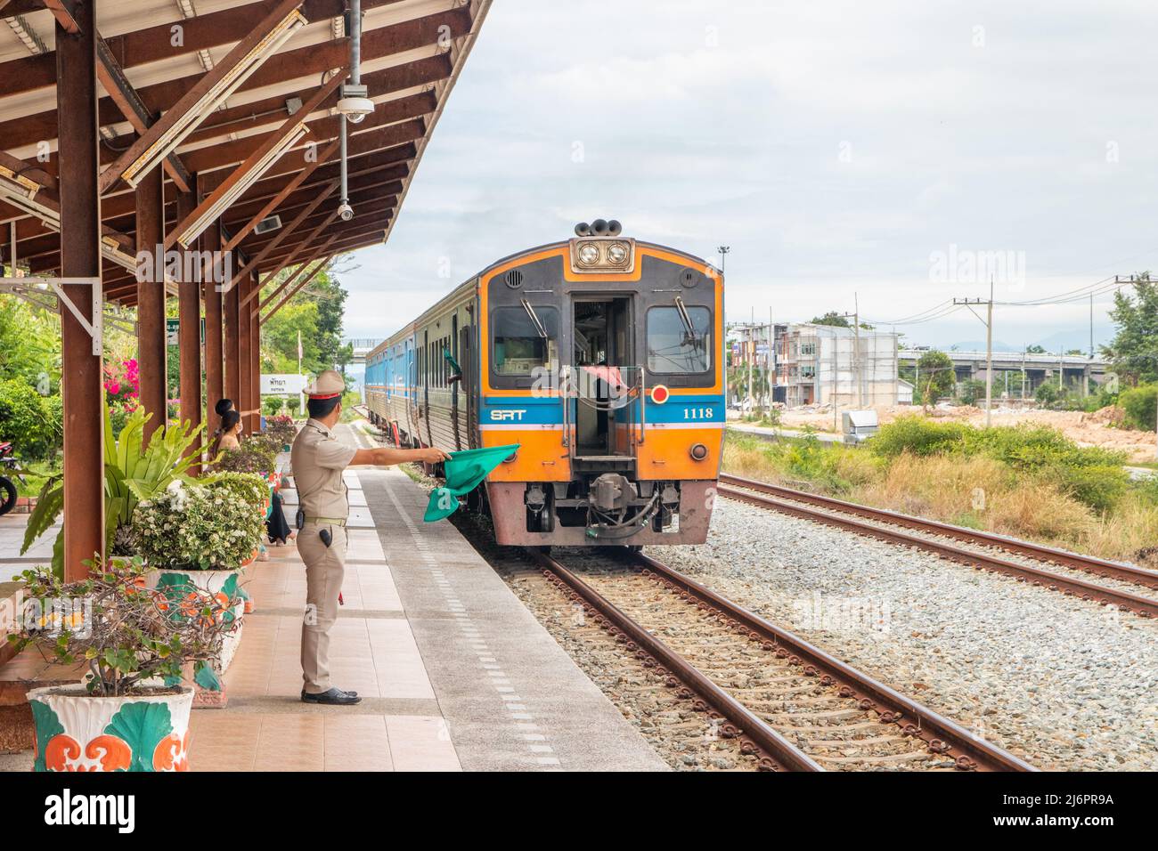 A train pulls into a station and waits for passengers in Thailand Stock ...