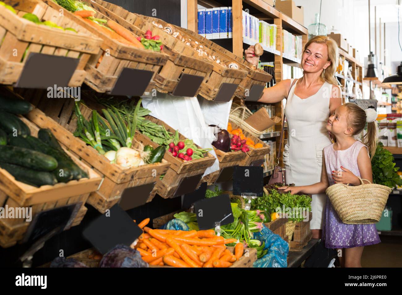 customers choosing vegetables Stock Photo - Alamy