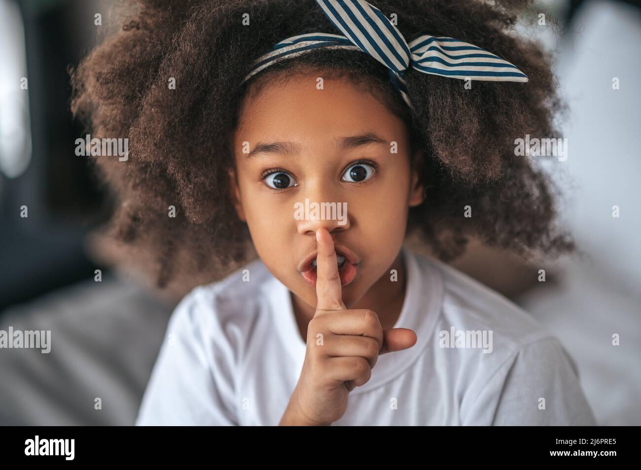 Cute kid girl showing silence hi-res stock photography and images - Alamy