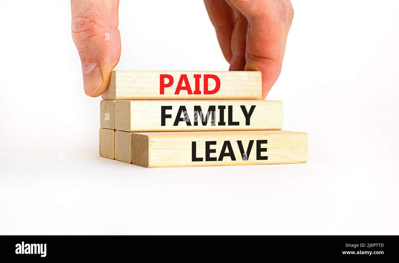 Paid family leave symbol. Concept words Paid family leave on wooden ...