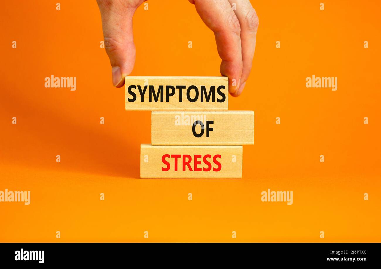 Symptoms of stress symbol. Concept words Symptoms of stress on wooden ...