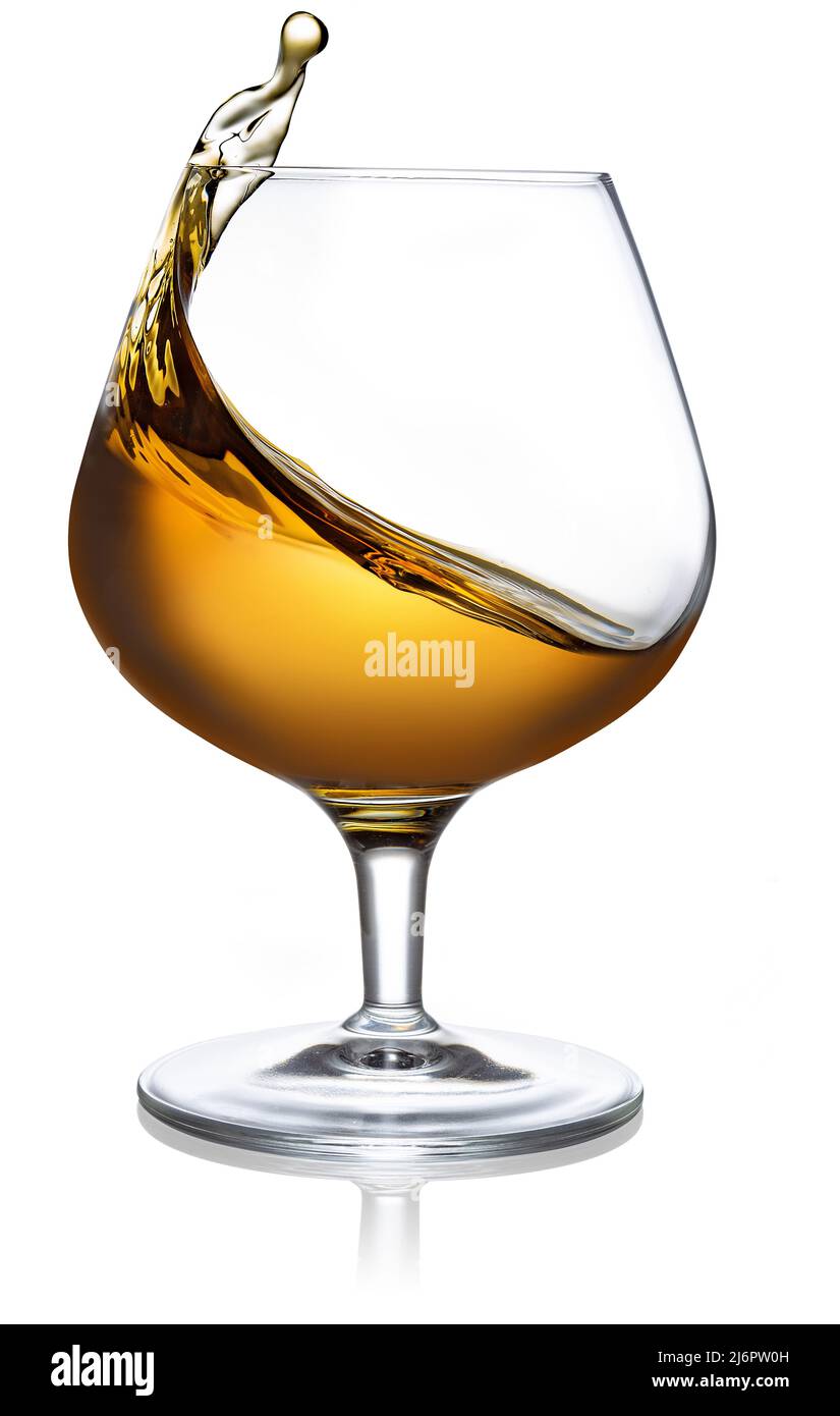 splash of cognac in a snifter isolated on white background Stock Photo ...