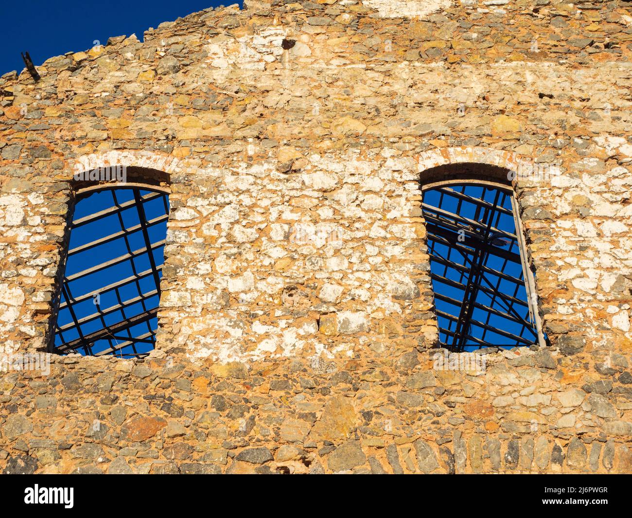 Stone façade of a building in ruins with windows Stock Photo - Alamy