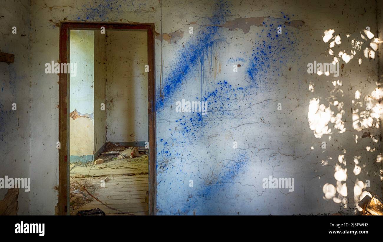 Interior of a ruined building with painted walls Stock Photo - Alamy