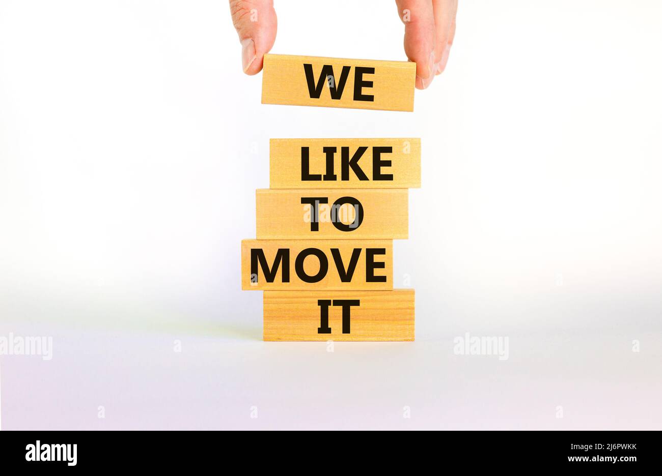 We like to move it symbol. Concept words We like to move it on wooden ...