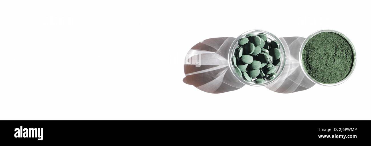 natural additives and superfood. green spirulina algae powder and pills ...