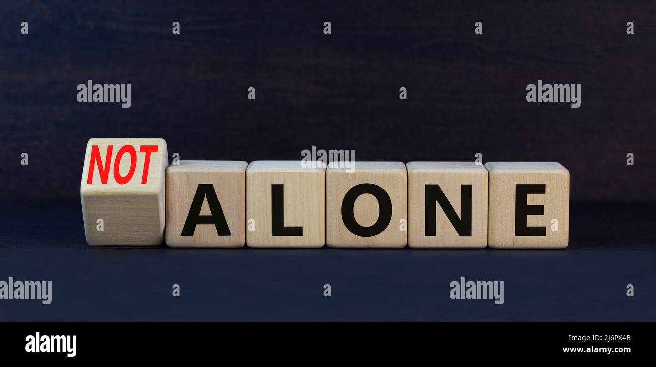 You are not alone symbol. Turned wooden cubes and changed concept words ...