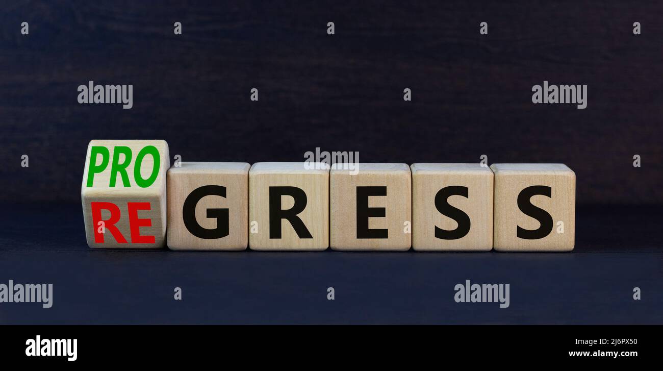 Regress or progress symbol. Turned wooden cubes and changed the word ...