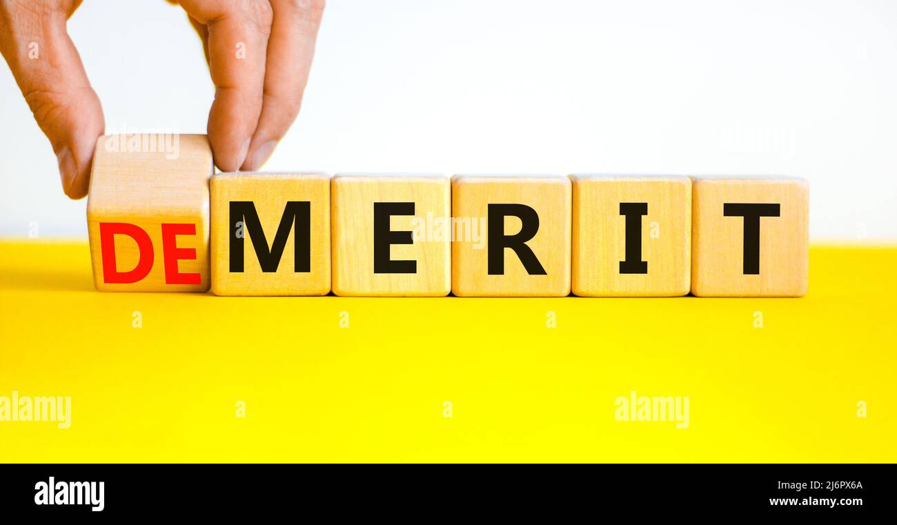 Demerit or merit symbol. Businessman turns wooden cubes and changes the ...