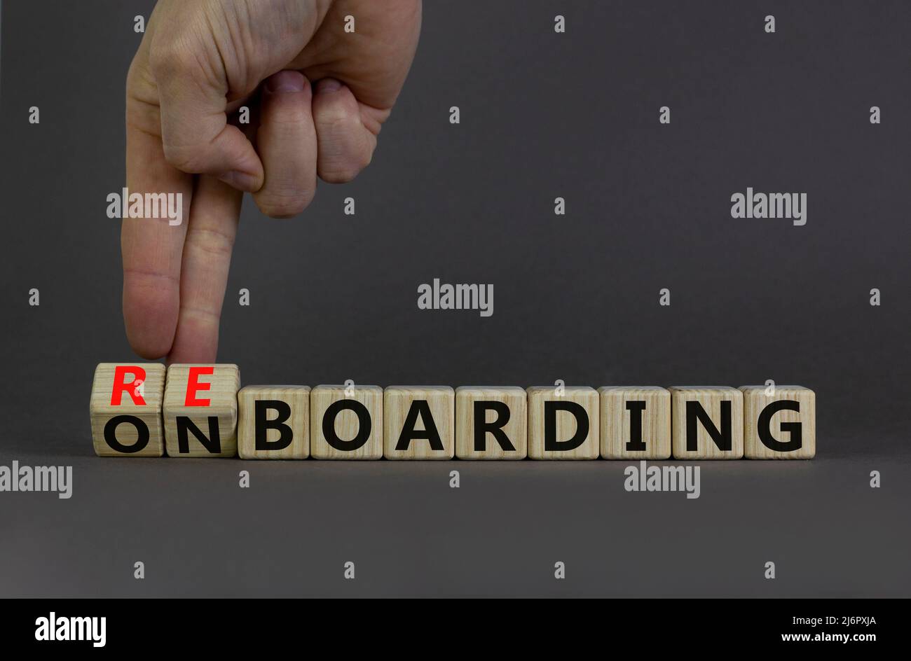Onboarding or reboarding symbol. Businessman turns wooden cubes and ...