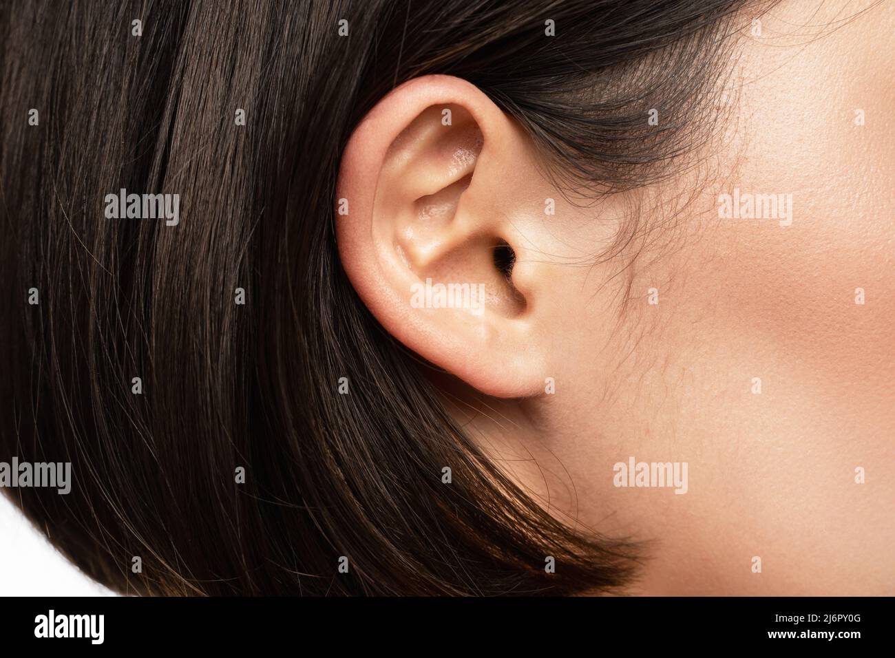 Close up view of caucasian female ear Stock Photo - Alamy
