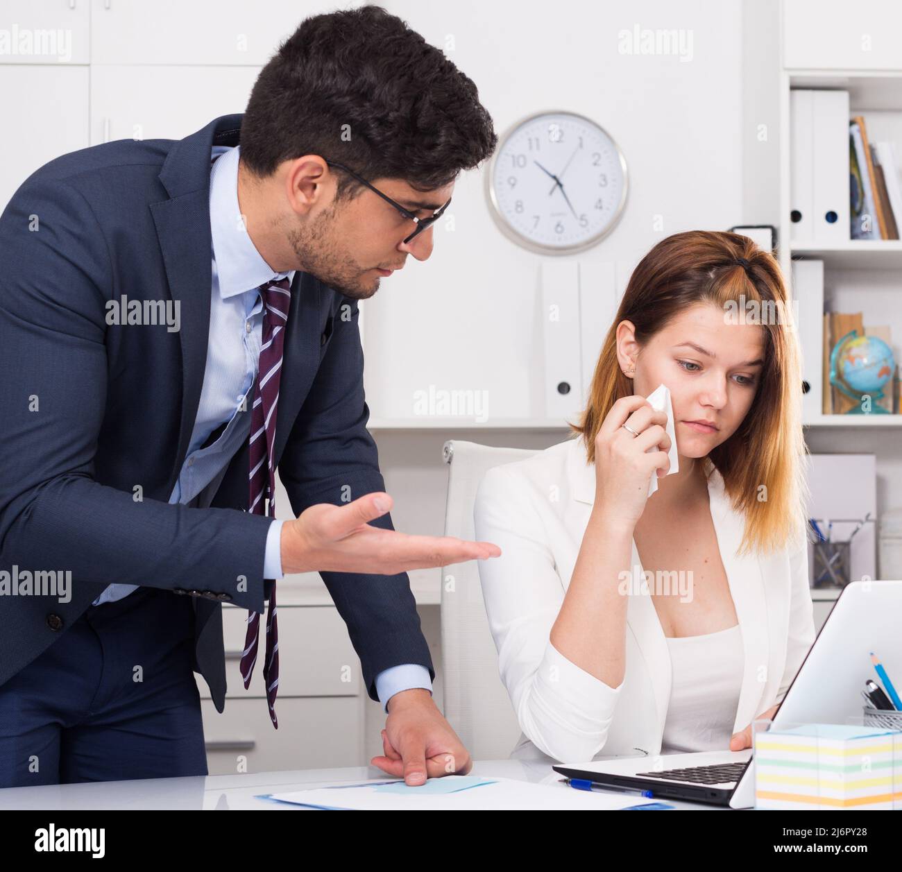 Businessman angry to female coworker Stock Photo - Alamy