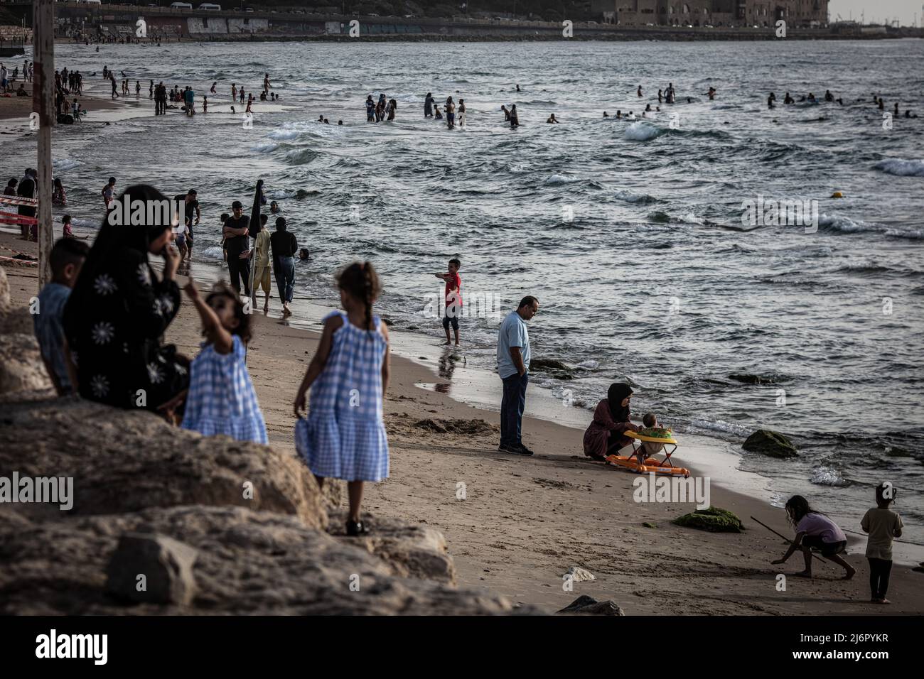 03 May 2022, Israel, Tel Aviv: People gather on the beach as they ...