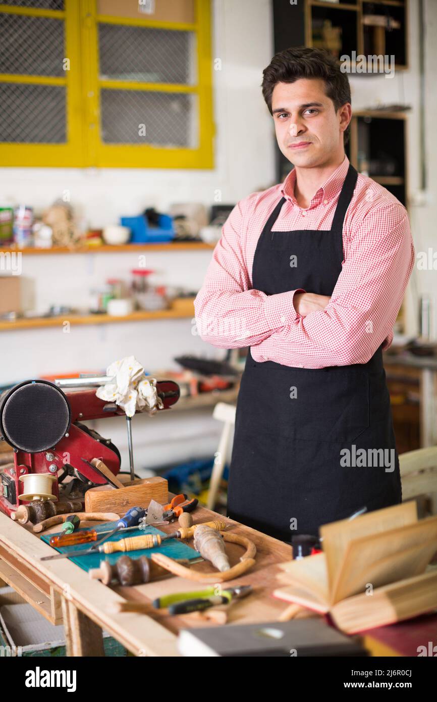 Carpenter working on manual lathe Stock Photo - Alamy