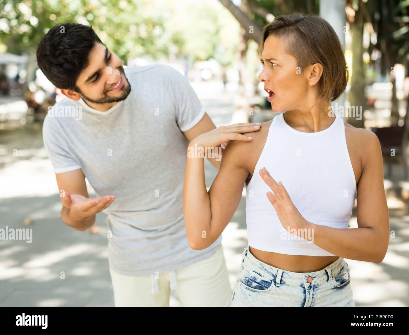 portrait of adult male and female talking emotional at the street Stock ...
