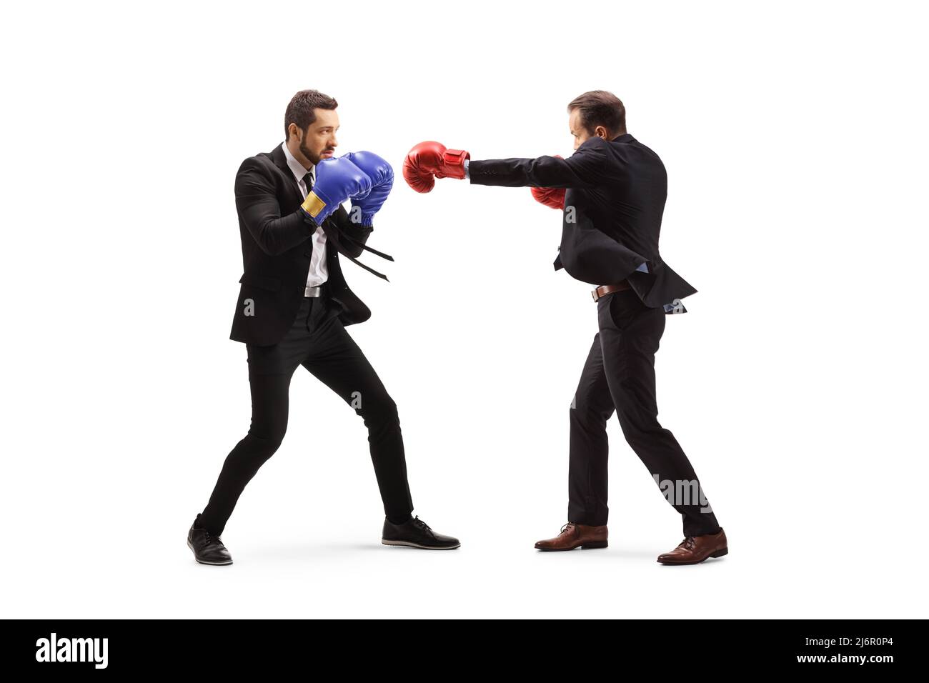 Full length profile shot of two businessmen fighting with boxing gloves ...