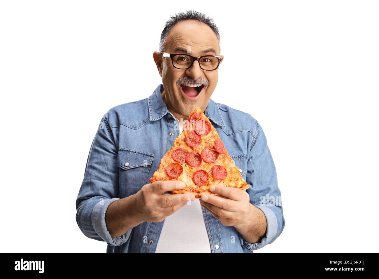Cheerful mature man eating pepperoni pizza and looking at camera ...