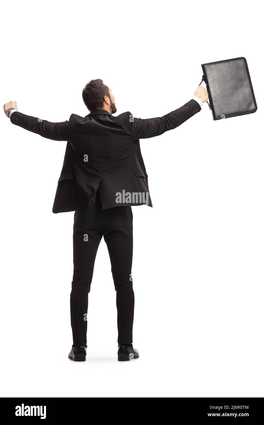 Rear view shot of a businessman with a briefcase celebrating success ...