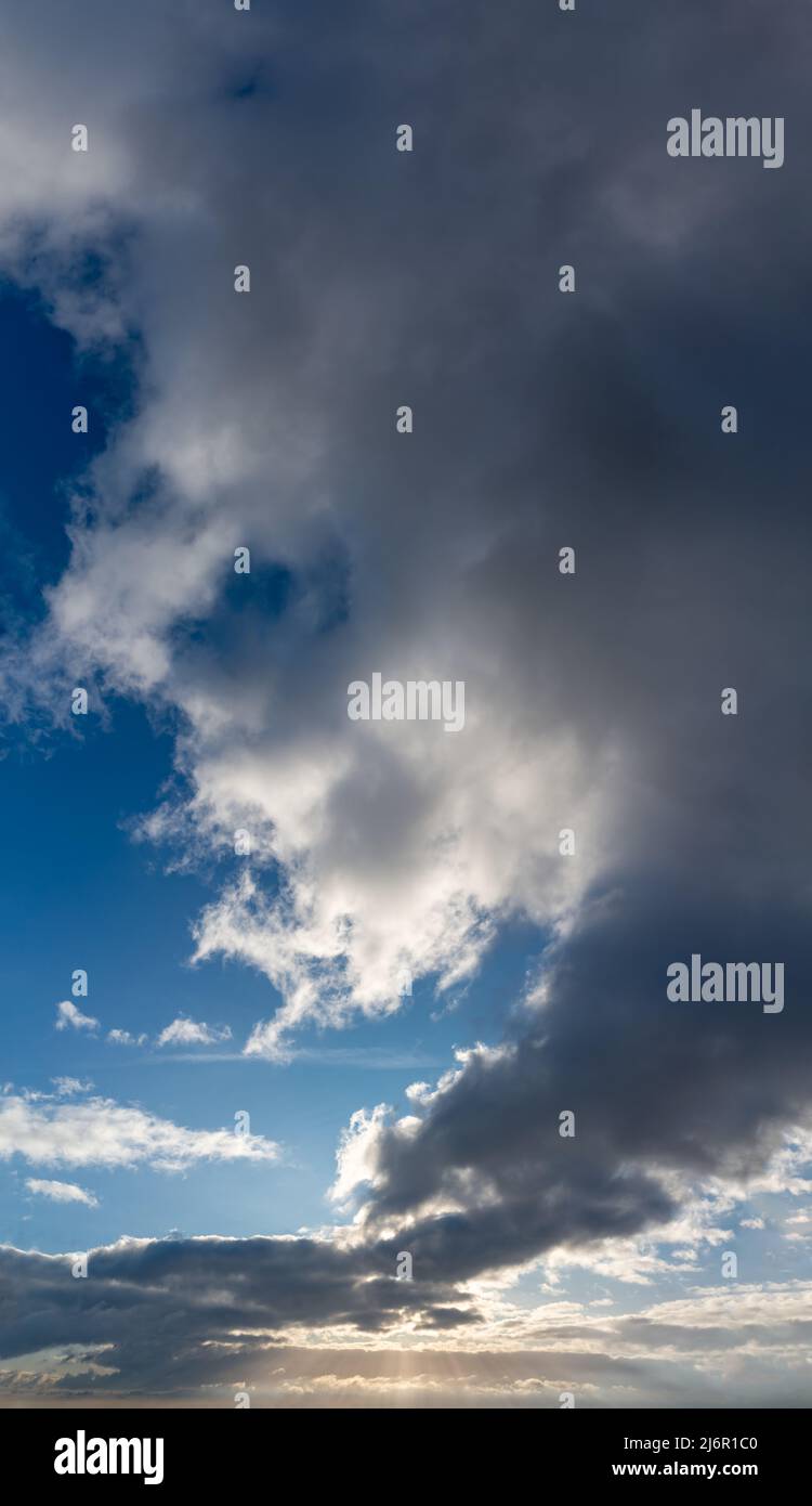 Fantastic thunderclouds at sunrise, vertical panorama Stock Photo - Alamy