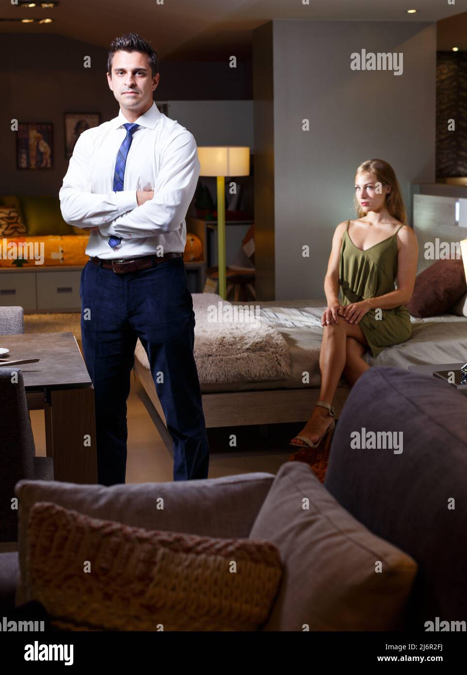 Elegant man in room with woman Stock Photo - Alamy