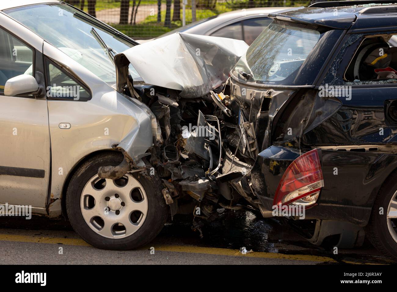Two cars are seen on the road after a crash Stock Photo - Alamy