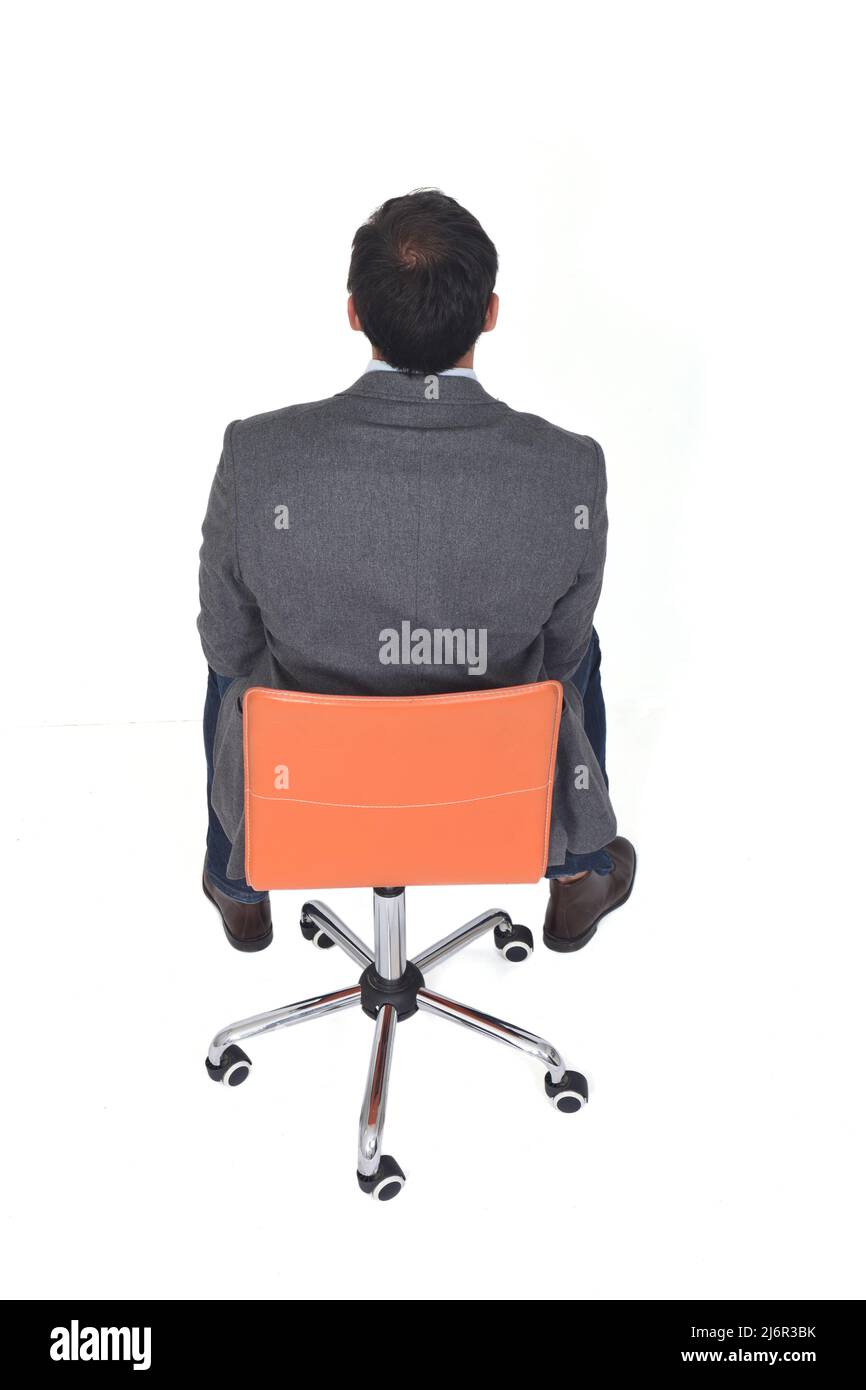 Man sitting on chair side angle Cut Out Stock Images & Pictures - Alamy