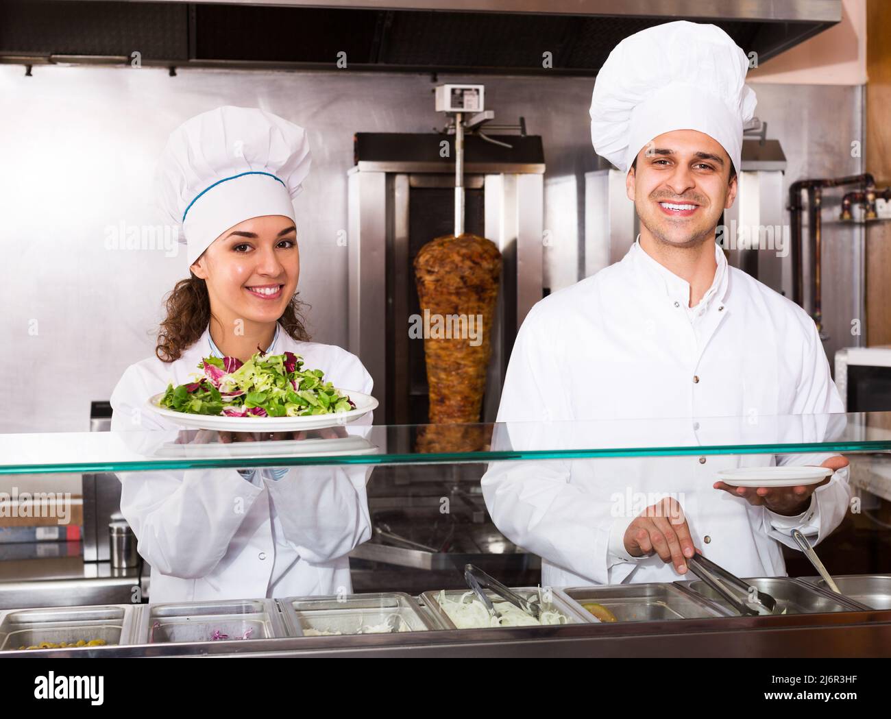 Staff posing at kebab counter Stock Photo - Alamy