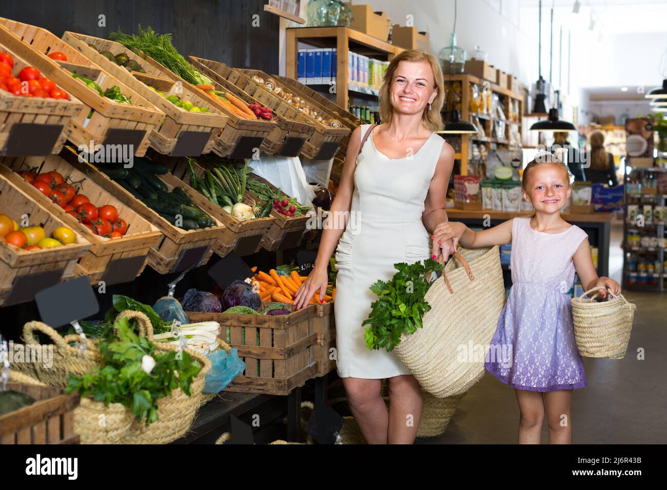 customers choosing vegetables Stock Photo - Alamy