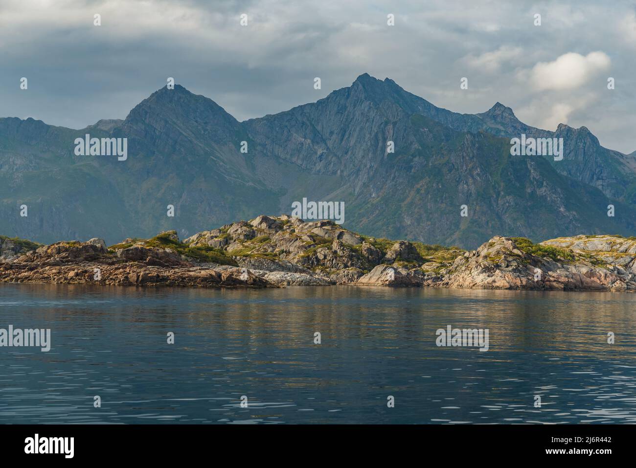 Norwegian seascape, rocky coast with dramatic skies, the sun breaks ...