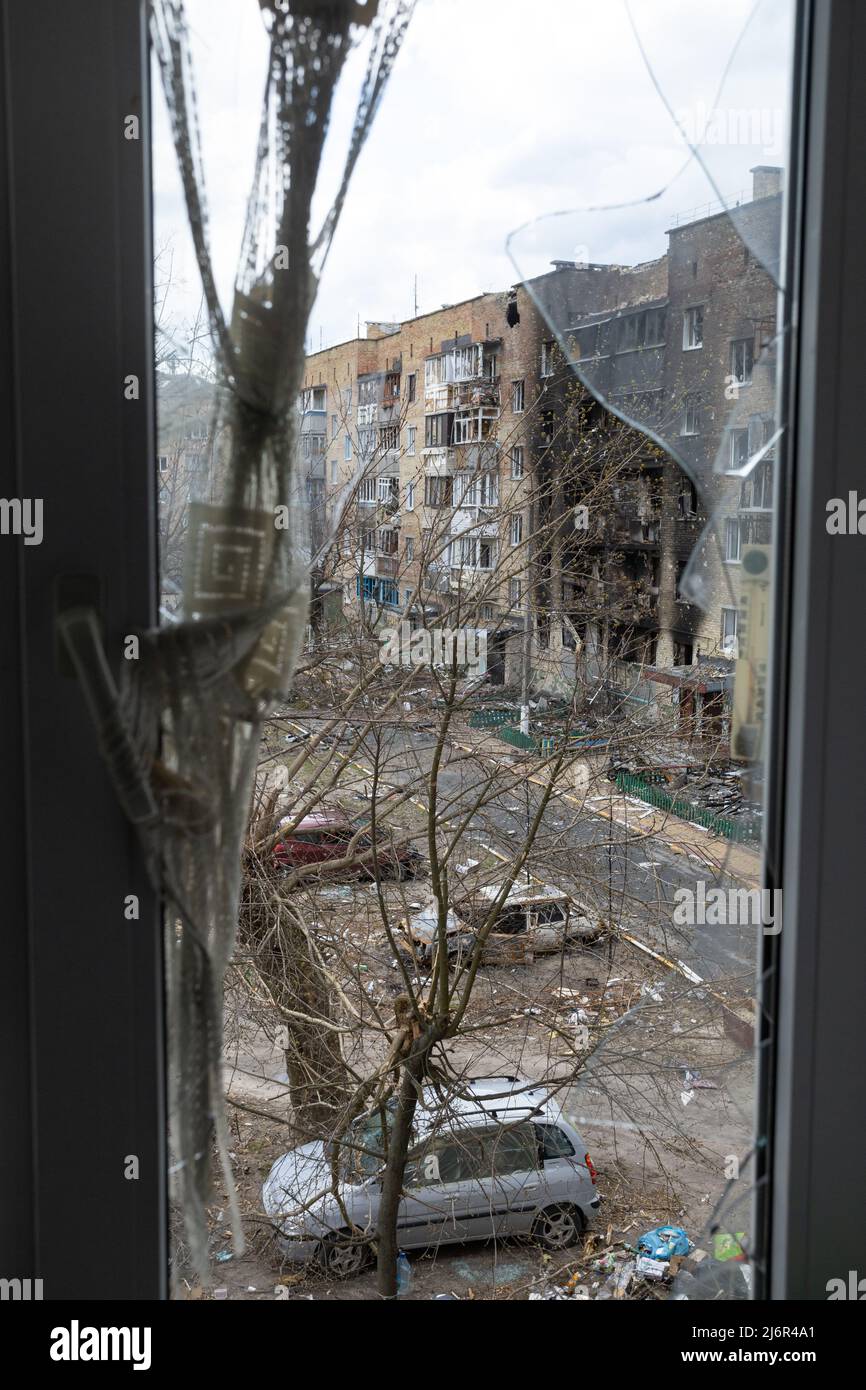 War between Russia and Ukraine. View from the window to the burnt house ...