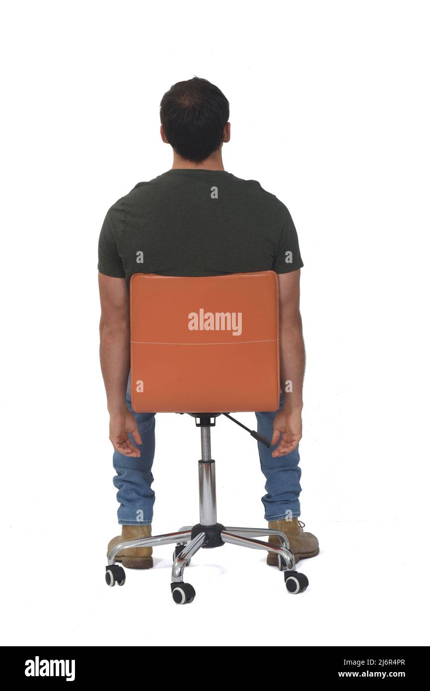 rear view of a man sitting on a chair on white background Stock Photo ...