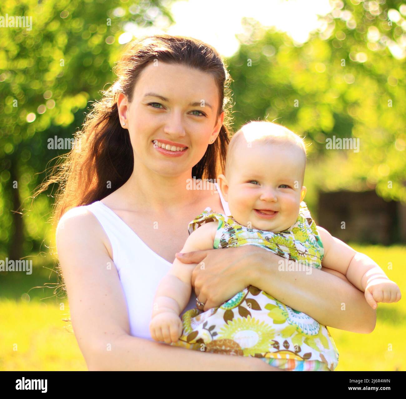 Beautiful Mother And Baby outdoors. Nature. Beauty Mum and her Child ...