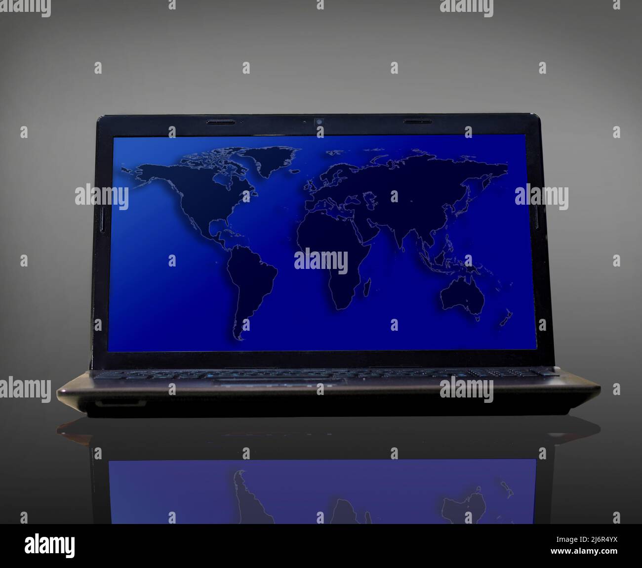 Laptop with map isolated on dark background Stock Photo - Alamy