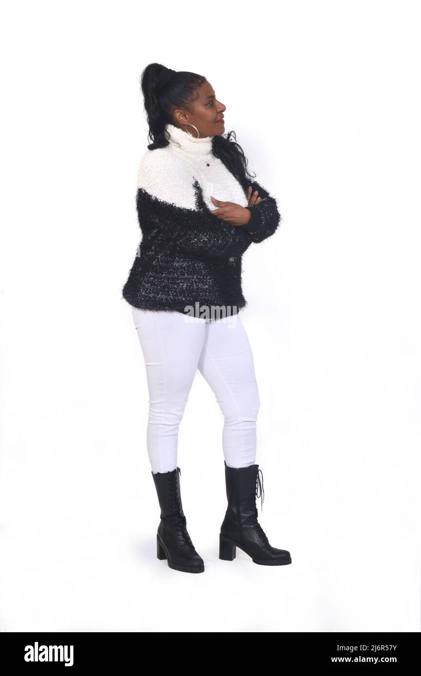 side view of a portrait of a woman arms crossed looking away, on white ...