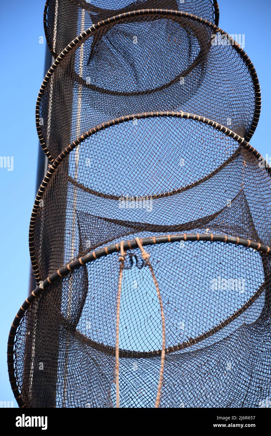 Circular nets hanging from a pole Stock Photo - Alamy