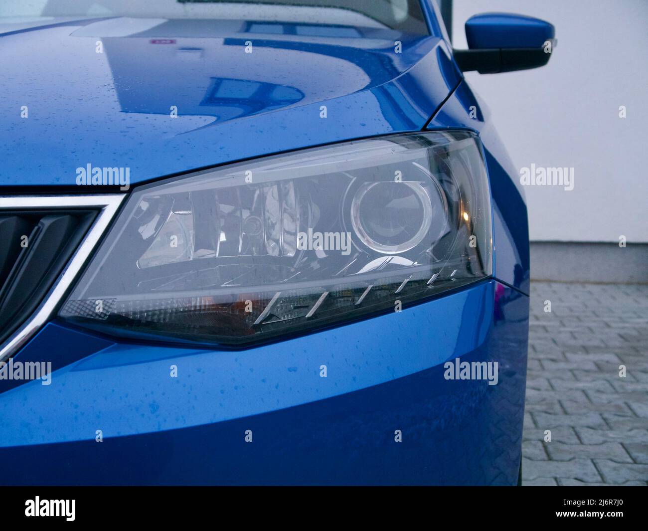 Clear headlights, modern blue car, reflections, close up Stock Photo ...