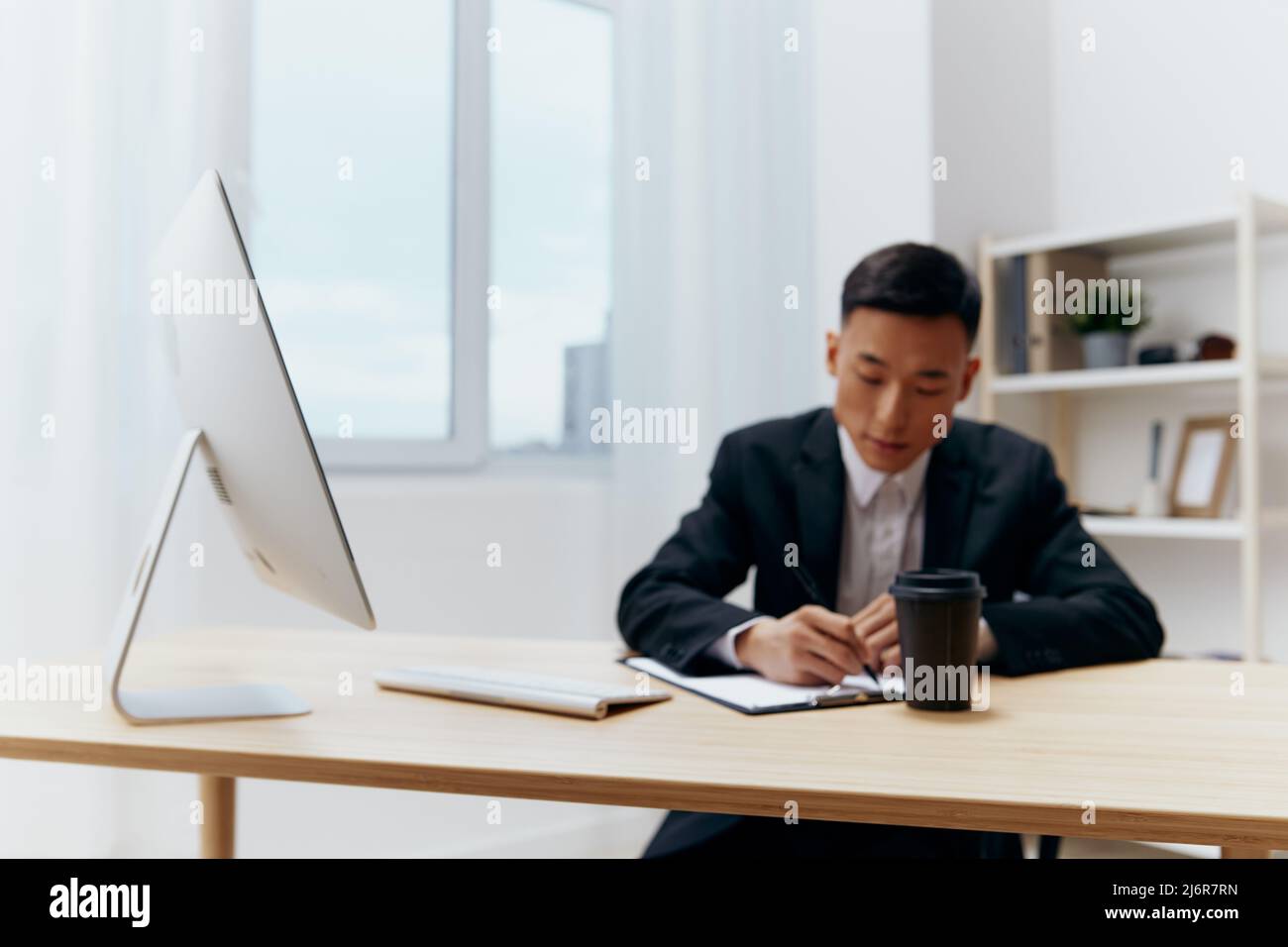 man sitting at a desk in front of a computer emotions technologies ...