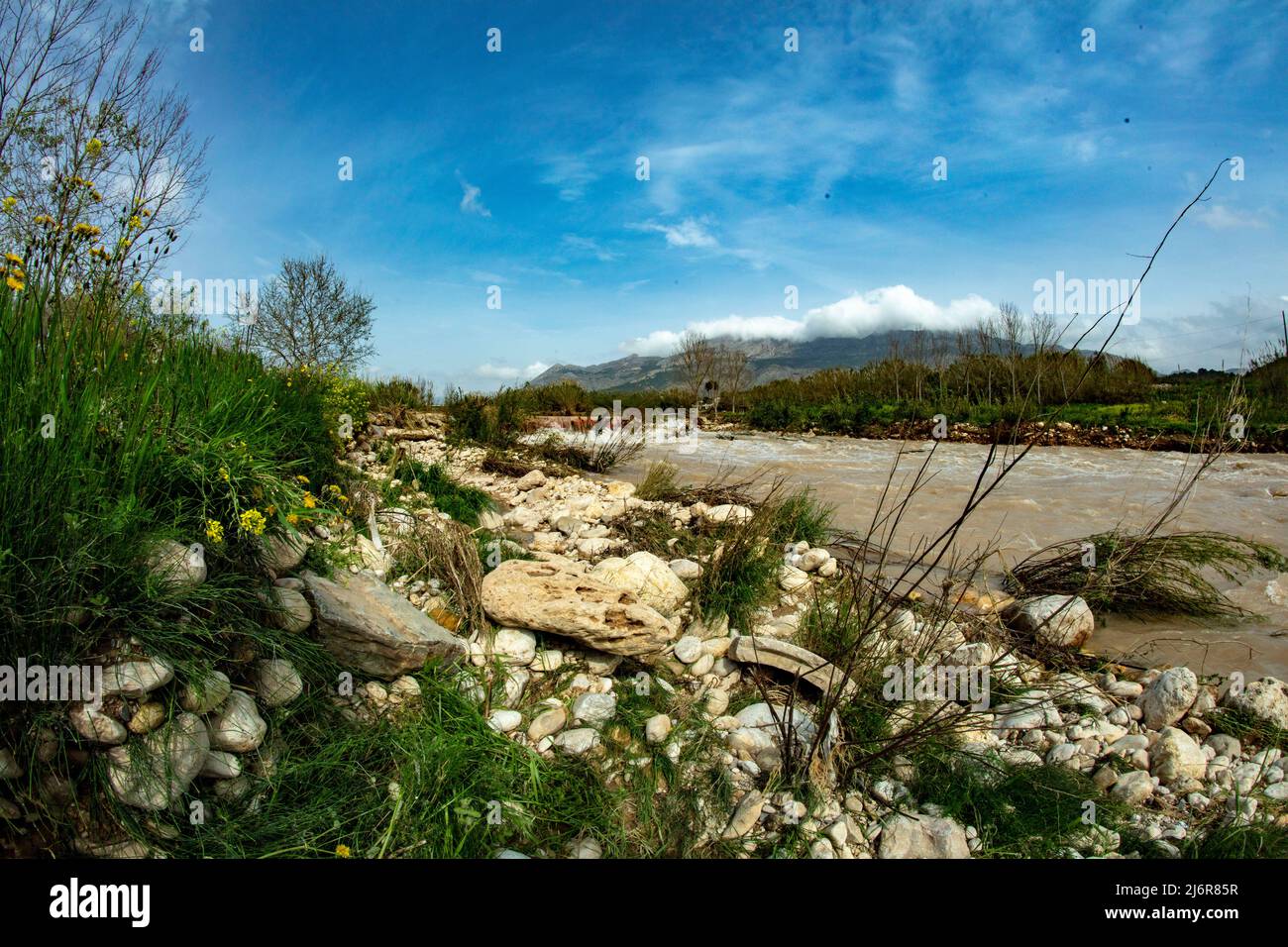 Natural landscape of Algar river in flood rushing under the road bridge ...